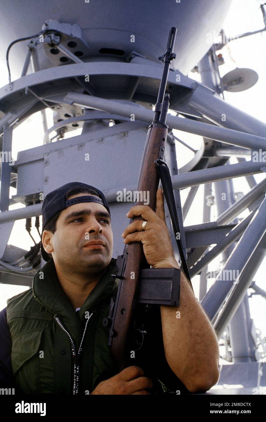 A sailor holding an M14 rifle stands guard aboard the hydrofoil patrol ...