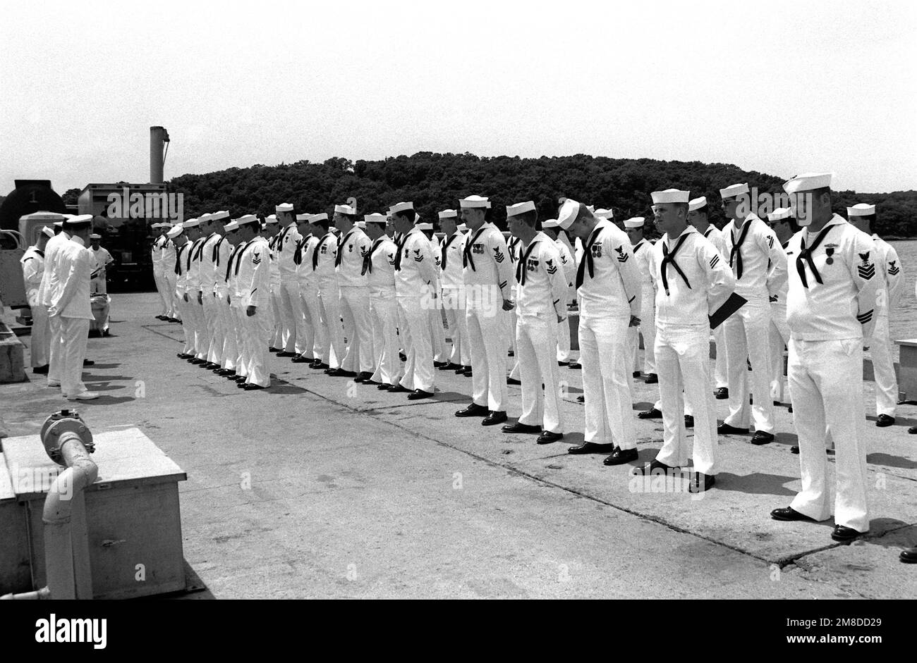 The crew of the nuclear-powered submarine USS MIAMI (SSN-755) stands in ...