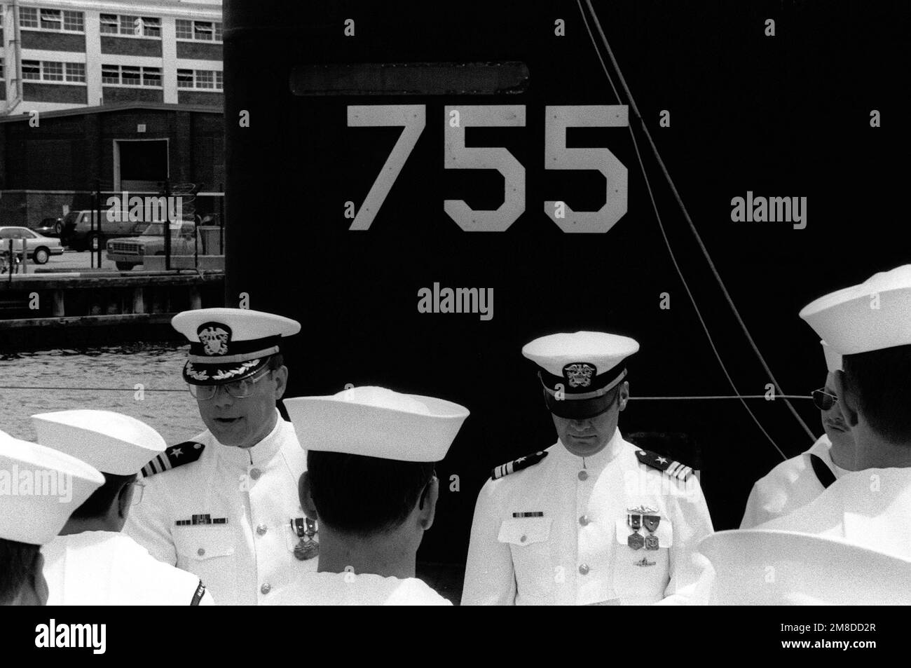 The commanding officer conducts a dress white inspection of his crew on ...