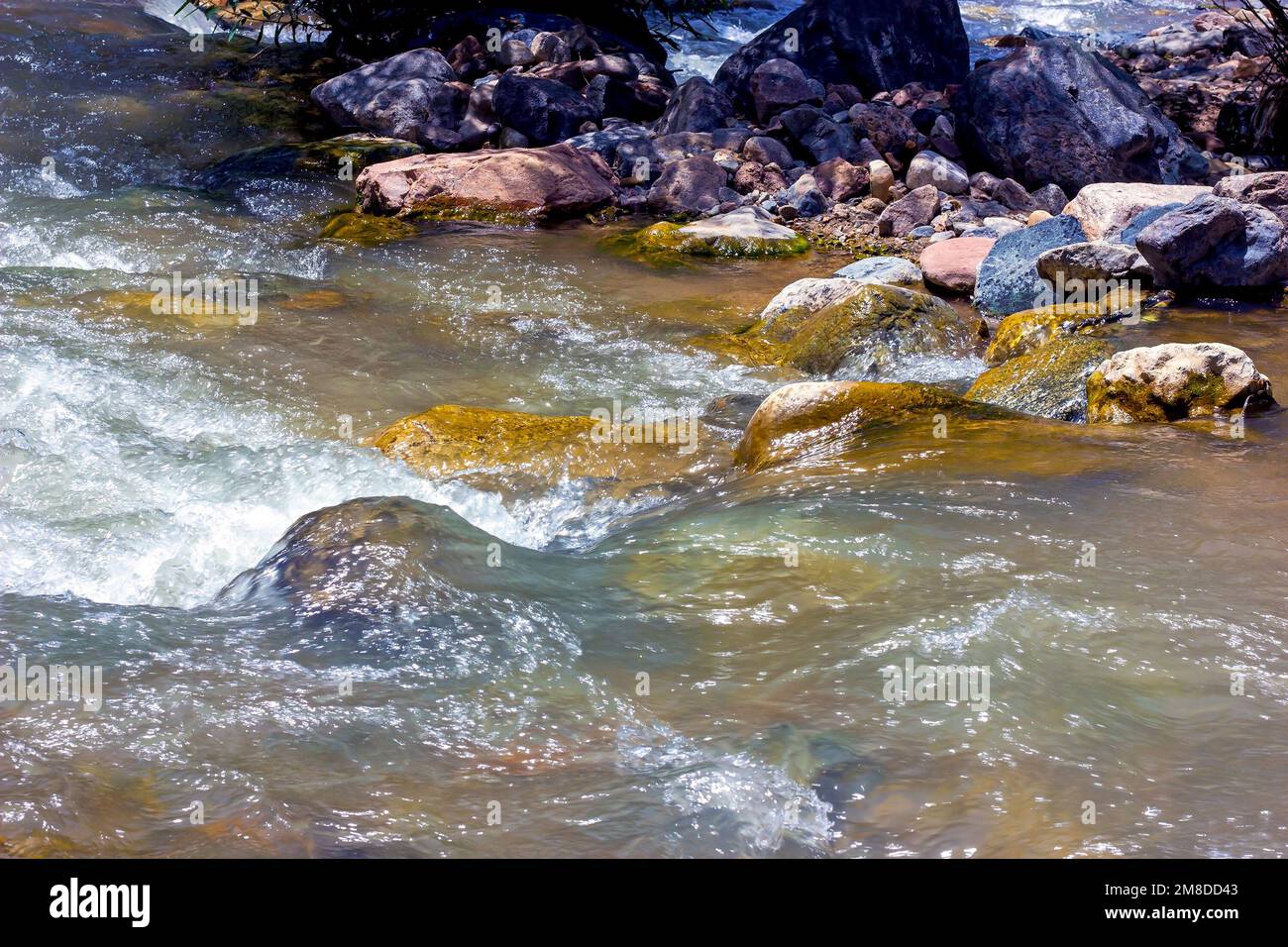 River flowing through mountain hi-res stock photography and images - Alamy