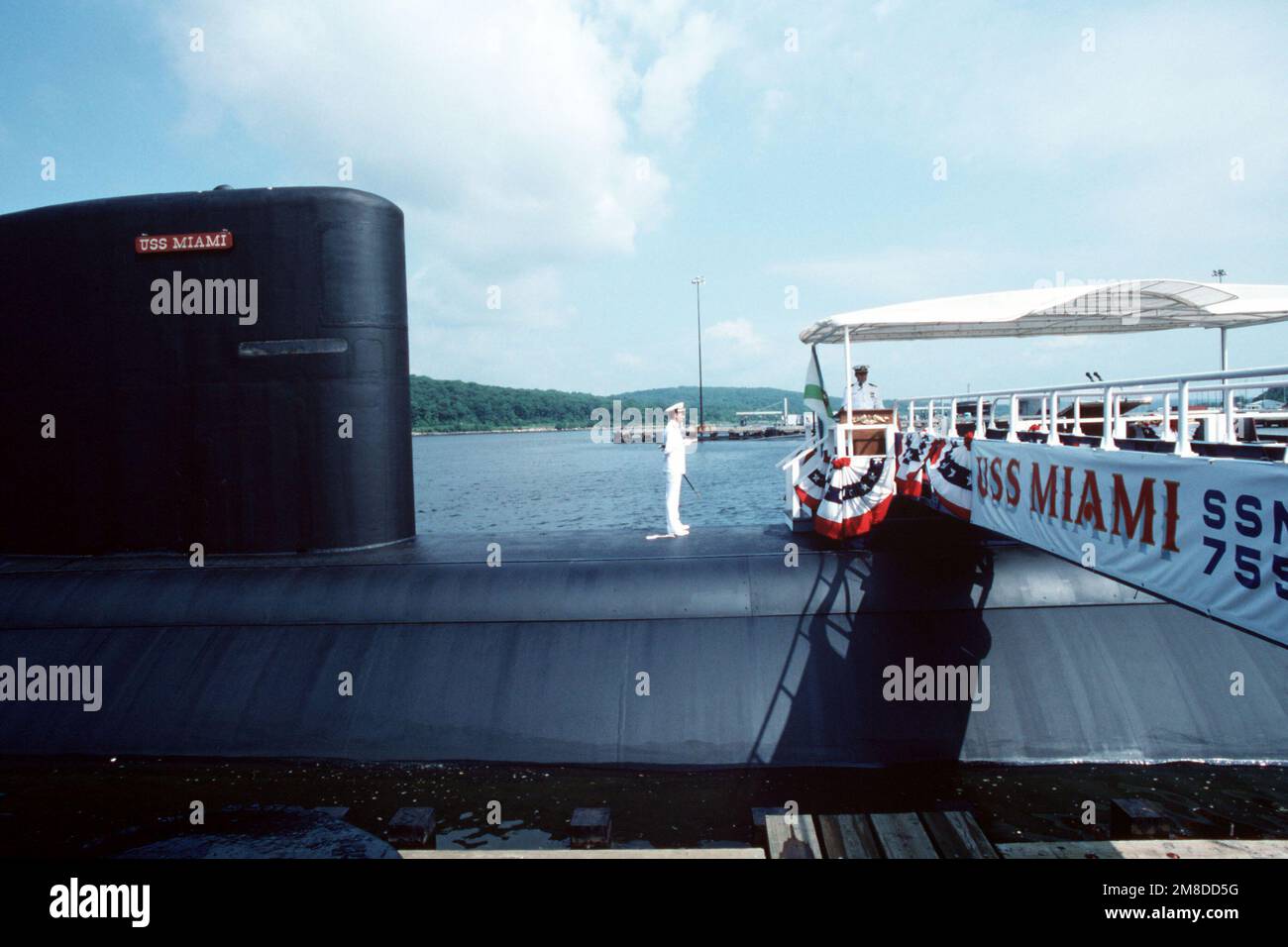 An officer speaks during the ship's commissioning ceremony of the ...