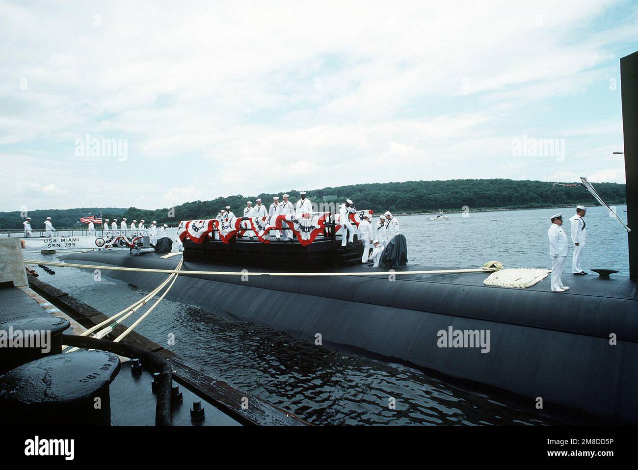 Crew members man the nuclear-powered attack submarine USS MIAMI (SSN ...