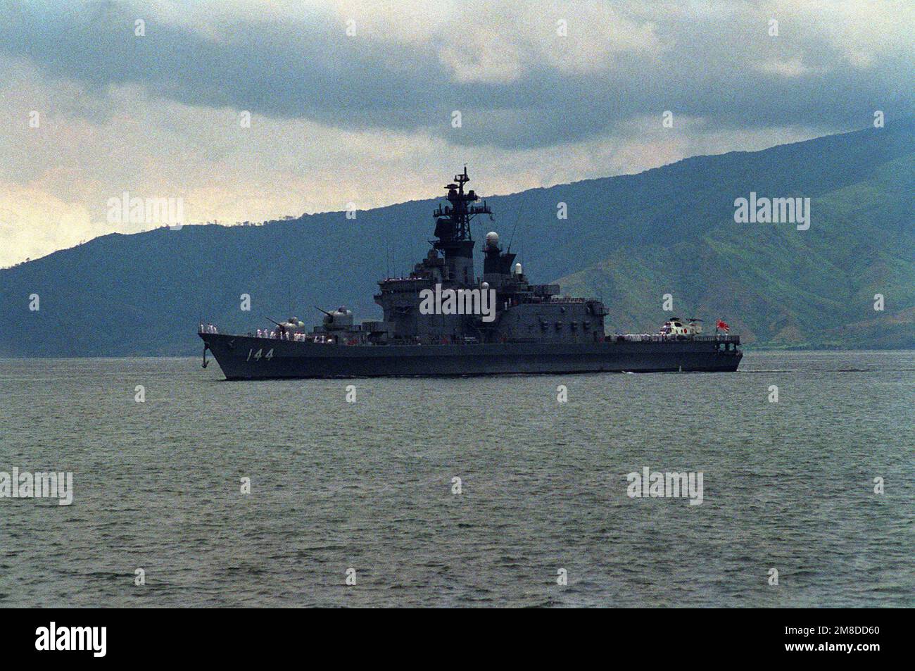 A port bow view of the Japanese destroyer JDS KURAMA (DD 144) underway ...