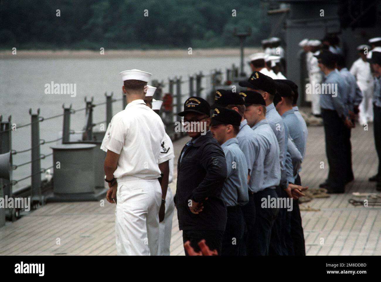 Crew members muster on the deck of the battleship USS WISCONSIN (BB-64 ...