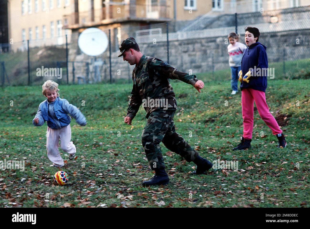 SGT. Erich Pfleaidermahnn plays soccer with East German refugee ...