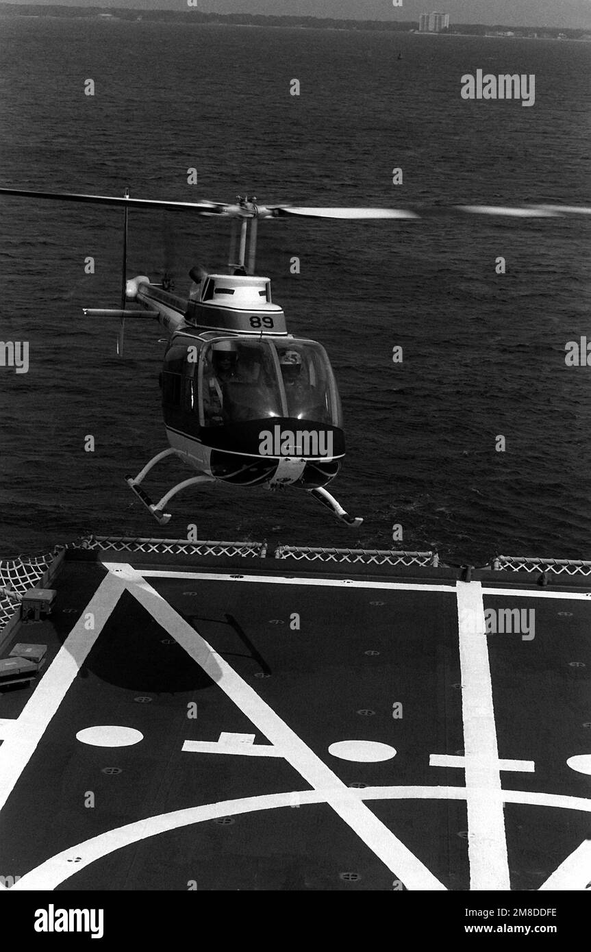 A Training Wing 5 (TAW-5) TH-57 Sea Ranger helicopter hovers over the ...
