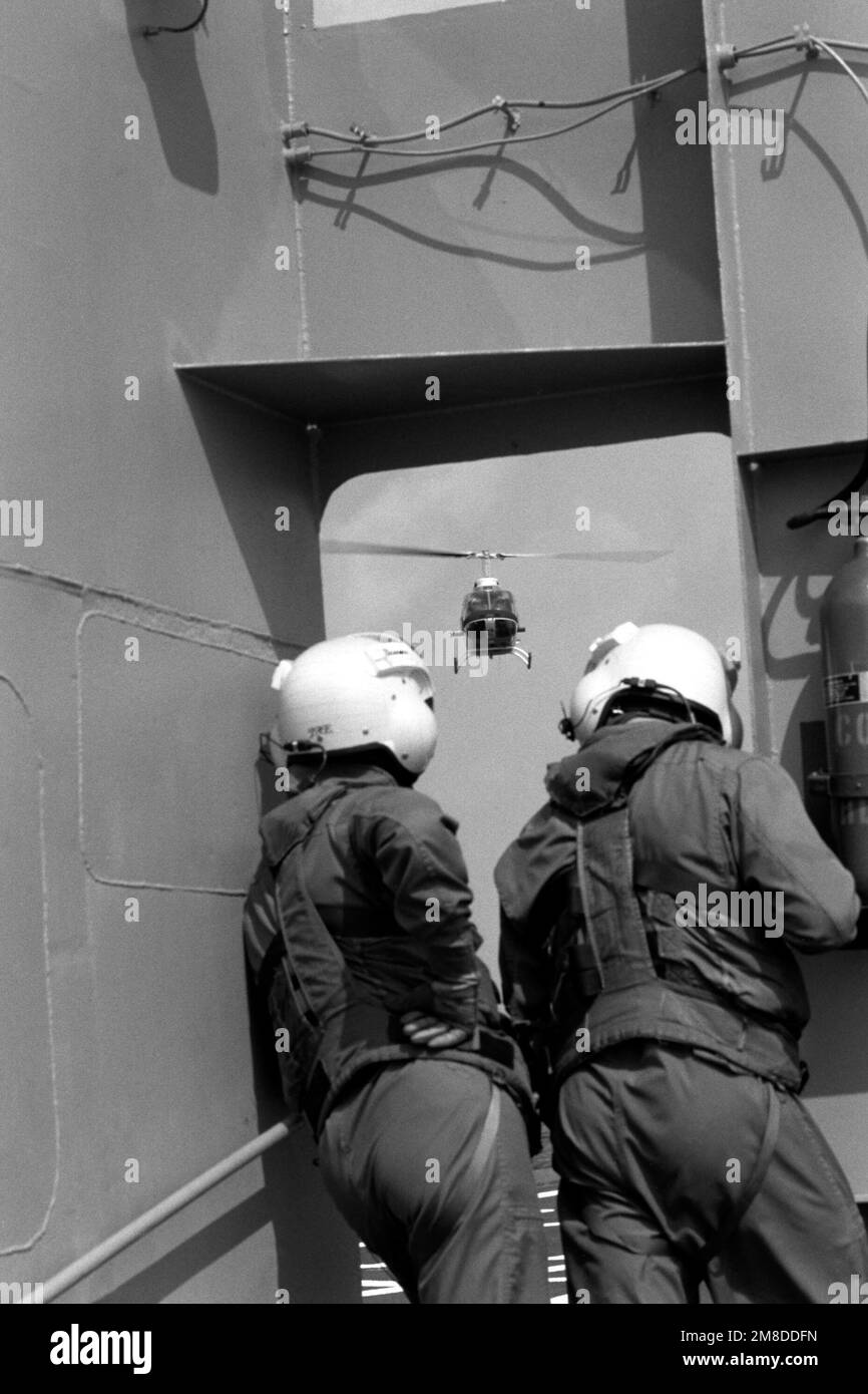 Two student pilots watch as a fellow Training Wing 5 (TAW-5) pilot ...