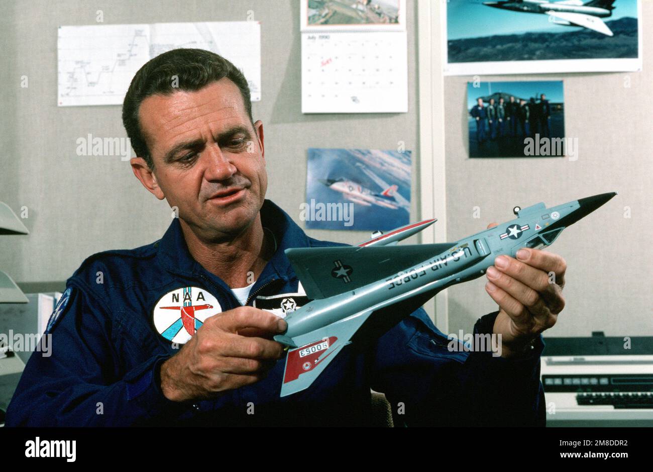 Gary Olin of Rockwell International holds a model of an F-106 Delta ...