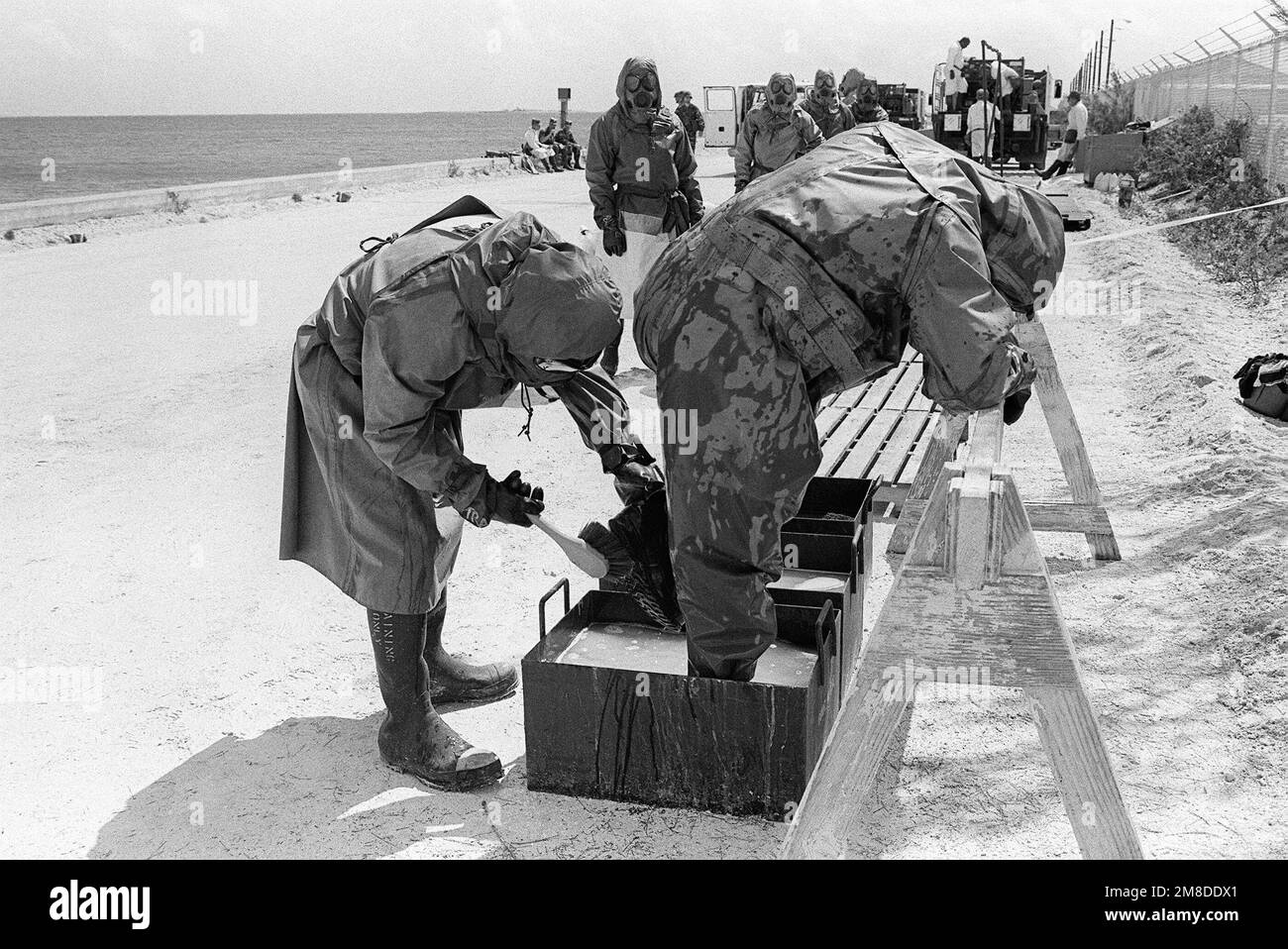 Dressed in full protective gear, a member of the 71st Chemical Regiment ...
