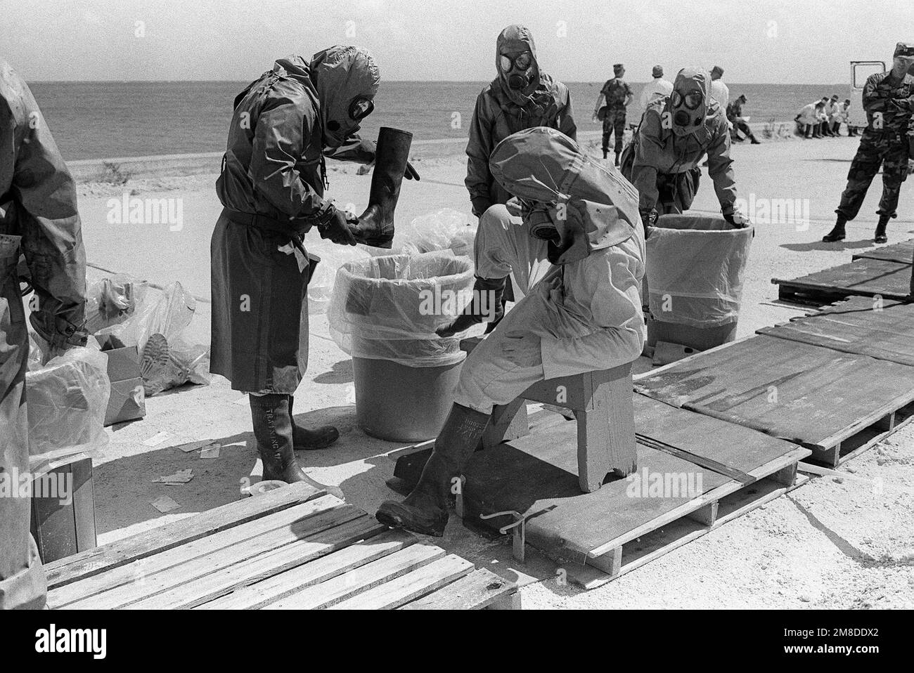 Dressed in full protective gear, a member of the 71st Chemical Regiment ...