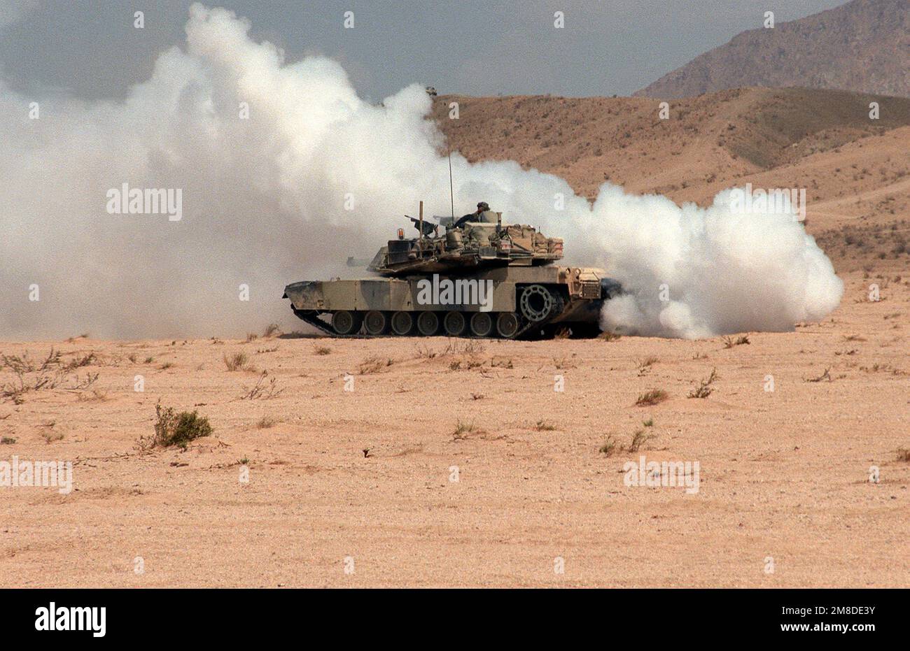 A Blue Forces M-1 Abrams main battle tank lays down a smoke screen ...