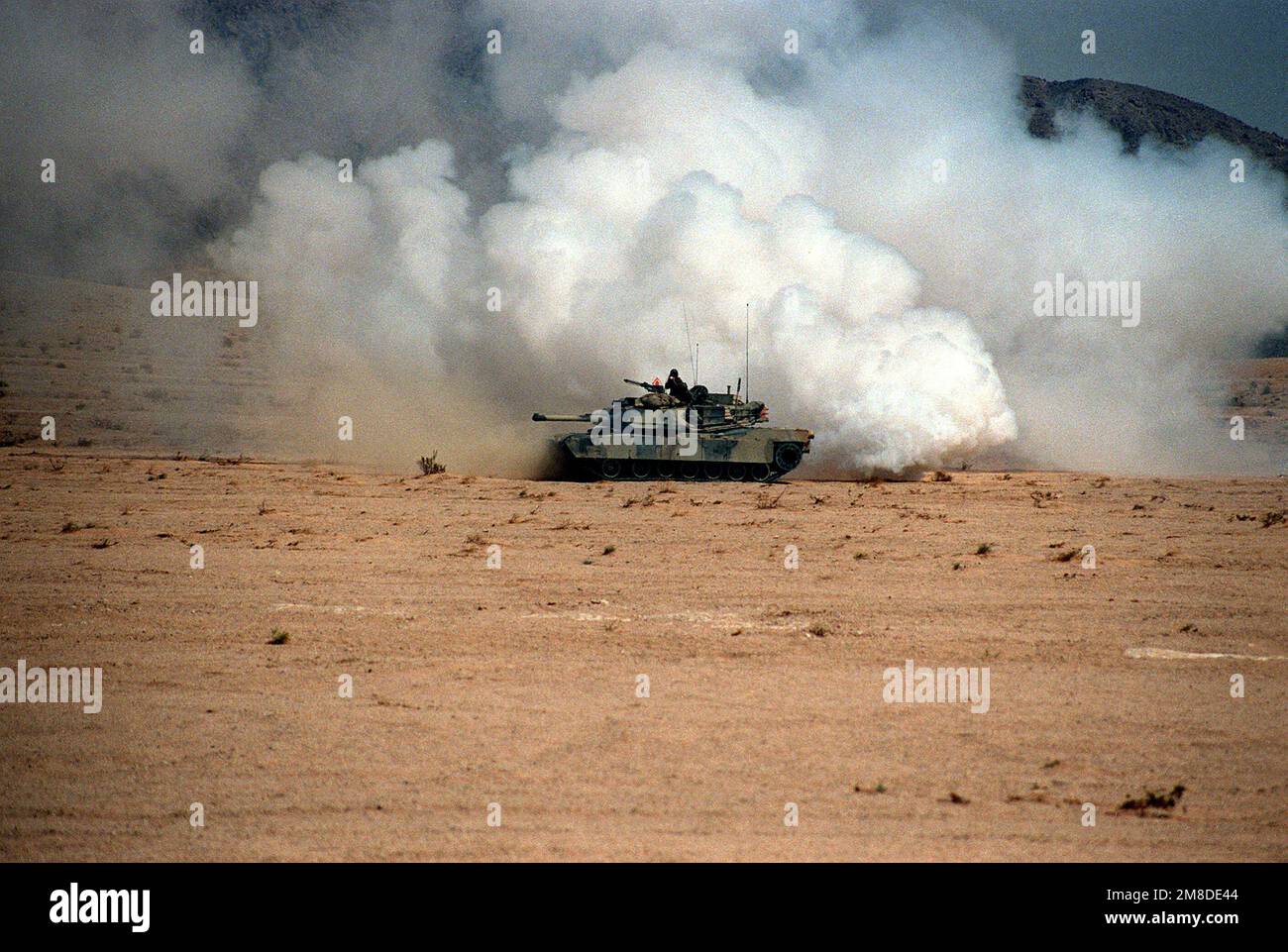 A Blue Forces M-1 Abrams main battle tank lays down a smoke screen ...