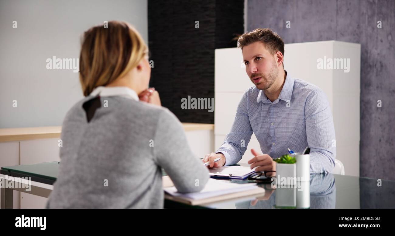 Two People Interview Meeting In Office. Hire Employee Stock Photo - Alamy