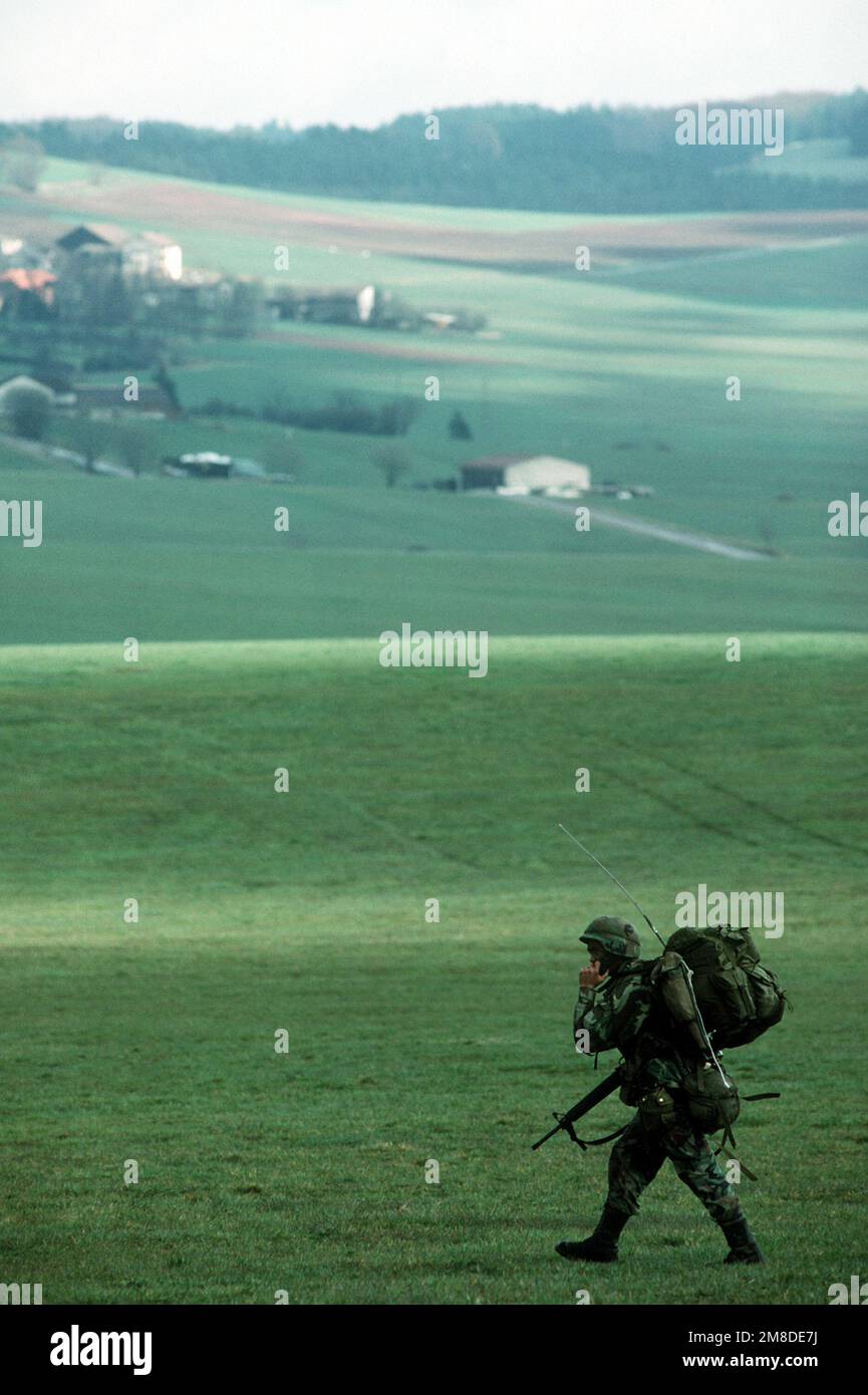 A soldier of the 3rd Battalion, 325th Infantry radios his position ...