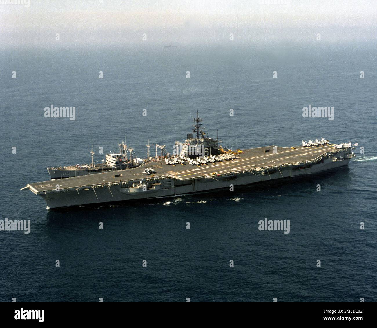 A port bow view of the aircraft carrier USS RANGER (CV-61) being ...