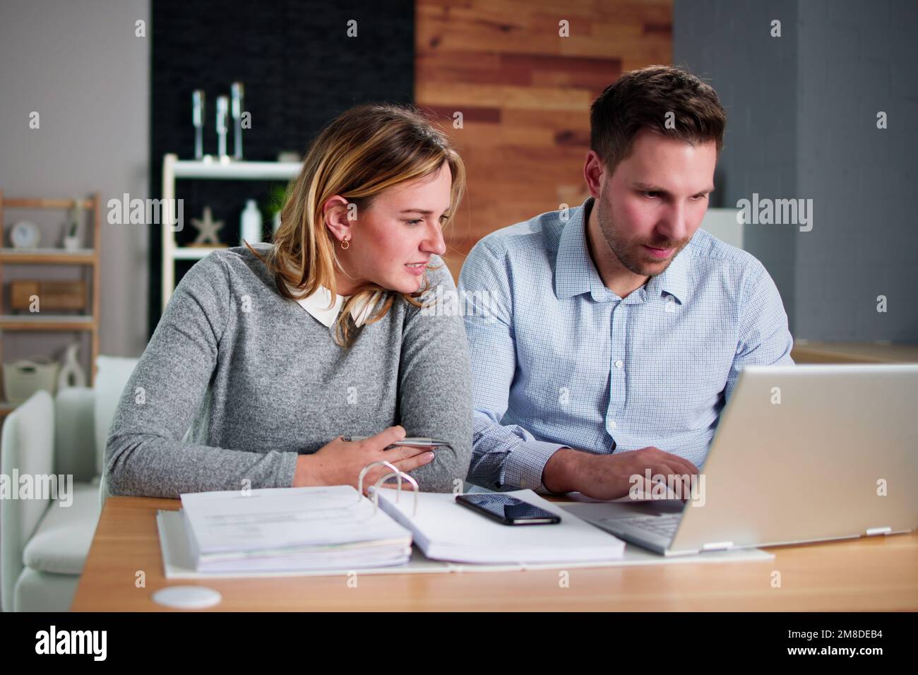 Couple Doing Taxes And Family Budget On Computer Stock Photo - Alamy