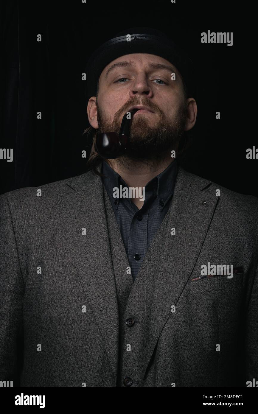 stylish man in retro outfit suit hat smoking wooden pipe sherlock ...