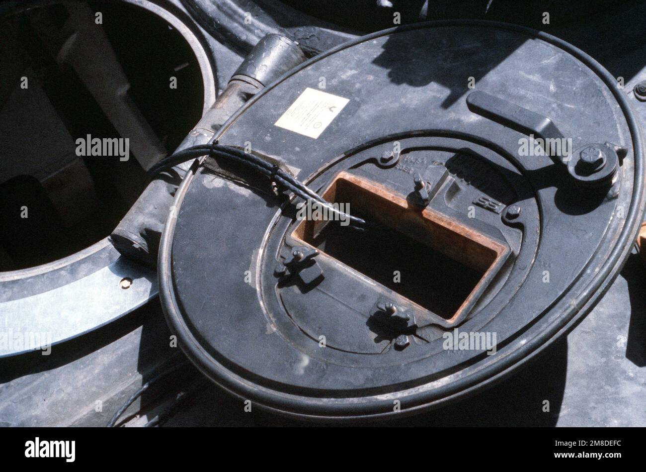 A view of a cable threaded through the periscope in the cover for the ...