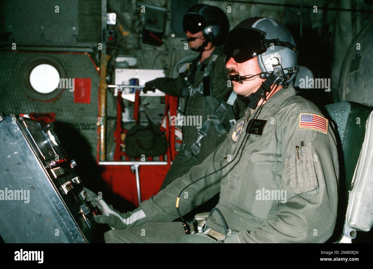SSGT Ronald Zahoryin monitors equipment as SSGT John Norquist stands by ...
