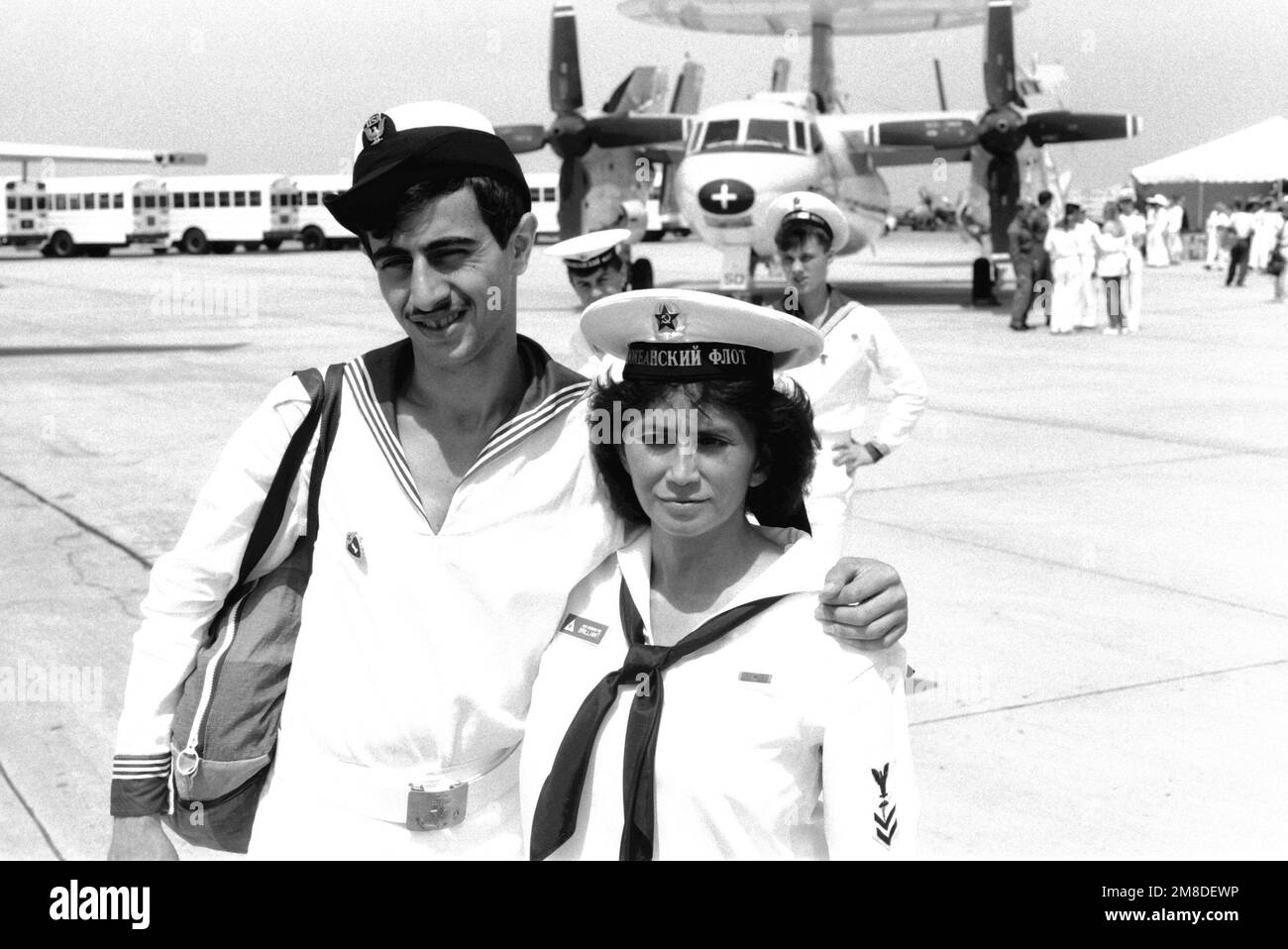 A petty officer wears a Soviet sailor's service cap as she stands ...