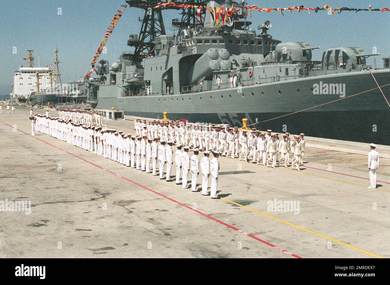 Soviet sailors march into position on the pier opposite a contingent of ...