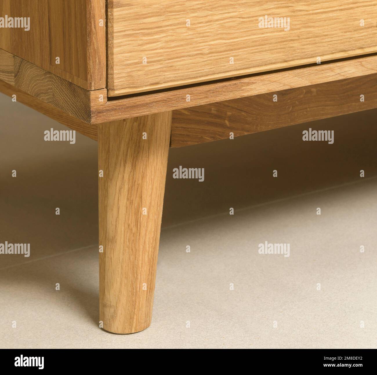 Wooden cupboard leg close view photo, wooden eco furniture elements ...
