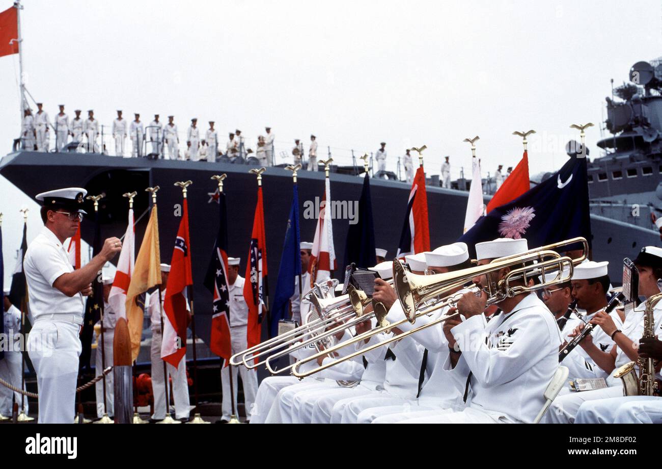 A United States (US) Navy band plays on the pier during a welcoming ...