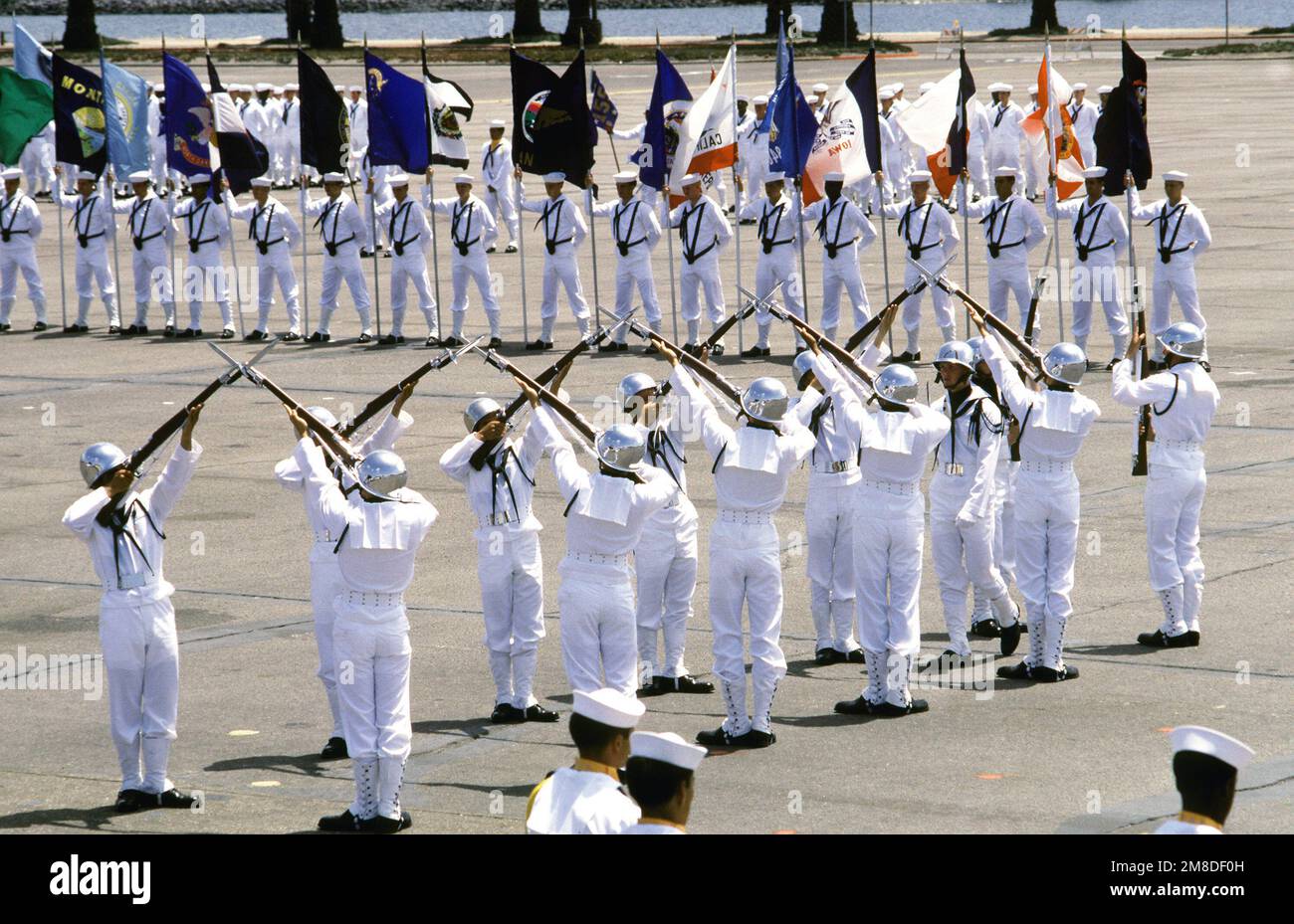 A United States (US) Navy drill team performs a rifle routine during a ...