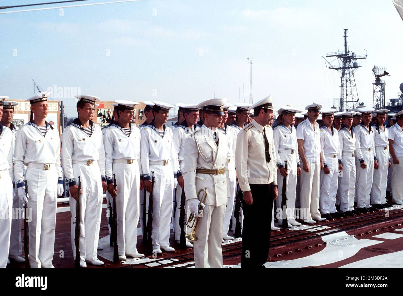 A trumpeter stands with a captain, third rank, in front of two ranks of ...