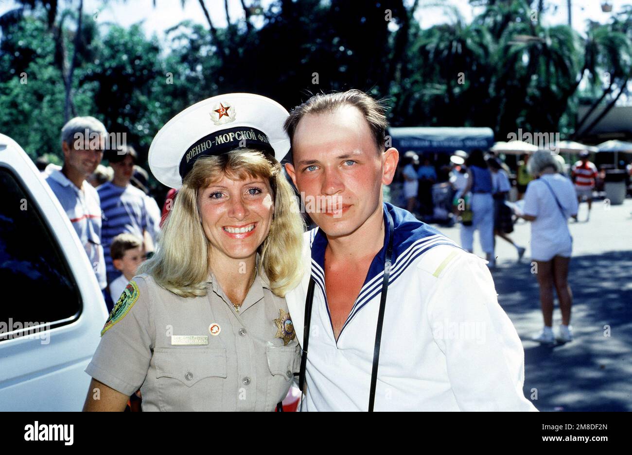 A Soviet sailor poses with a security guard at the San Diego Zoo. Three ...