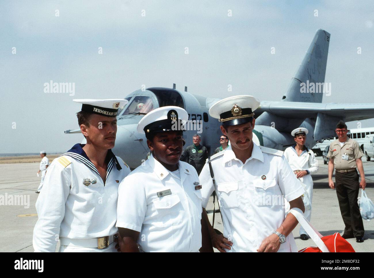 A Soviet sailor and an officer stand on either side of a United States ...