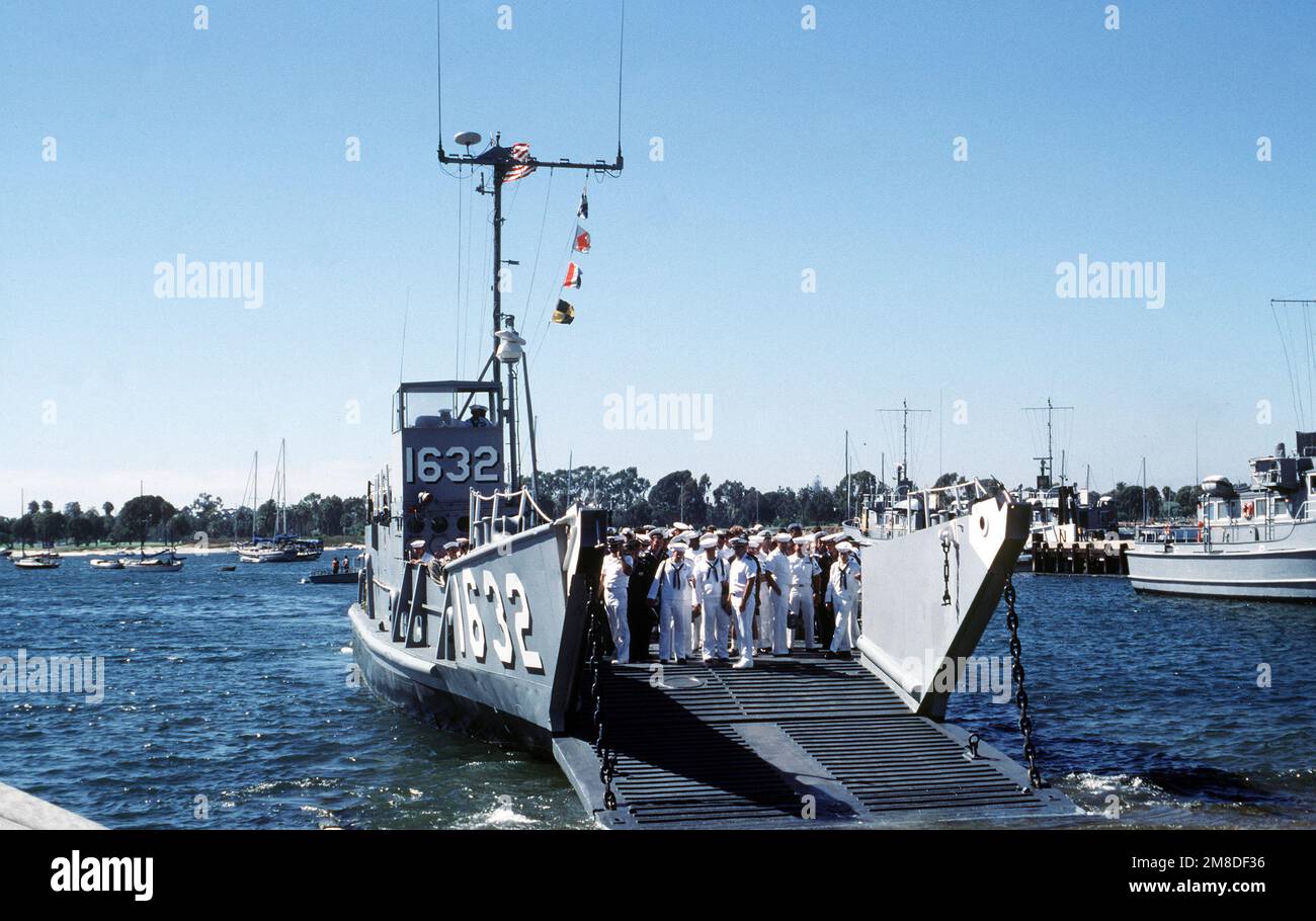 Soviet and United States navy personnel wait to depart on a tour aboard ...