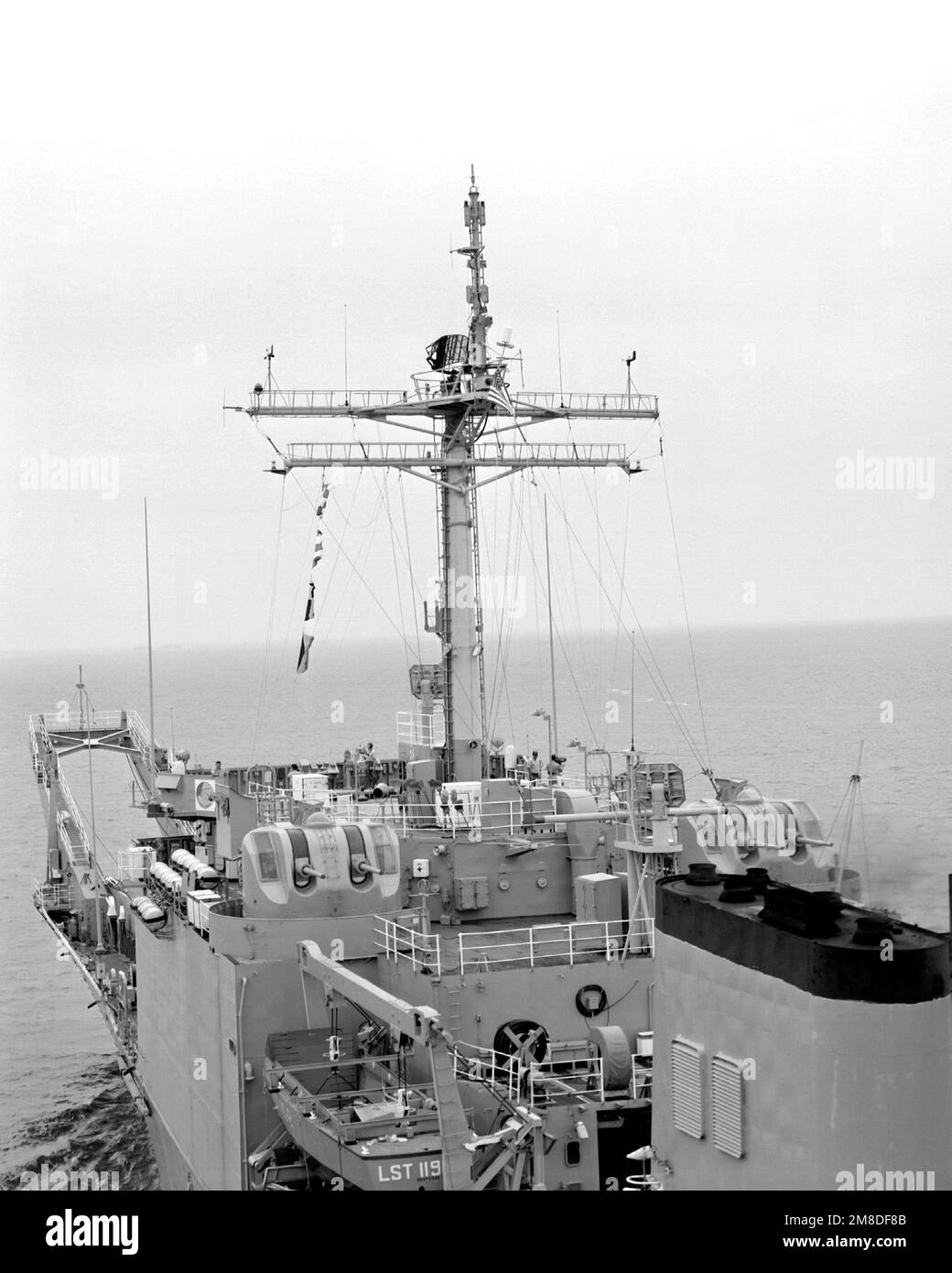 A port view of antenna rigging on the mast of the tank landing ship USS ...