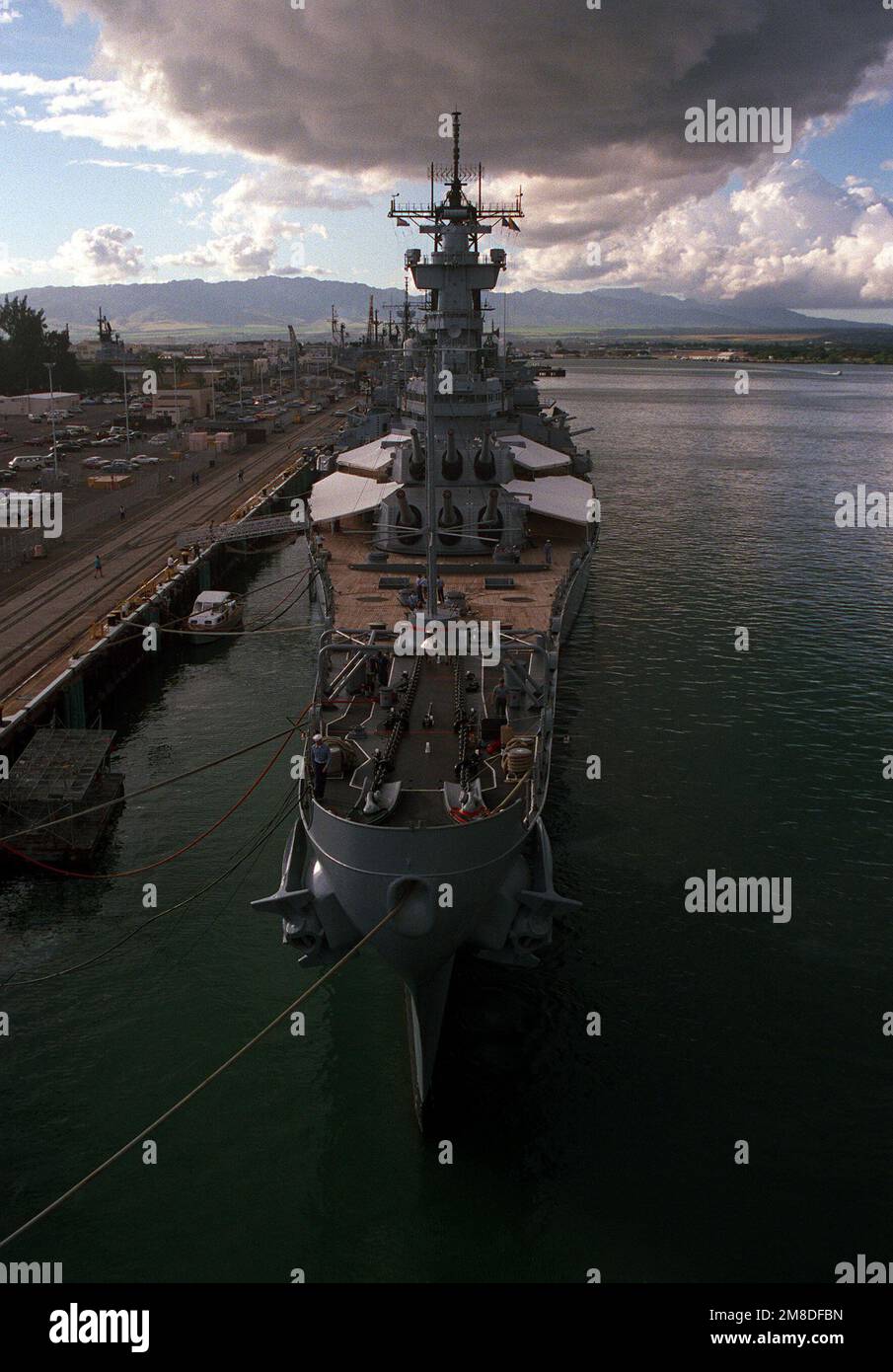 The battleship USS NEW JERSEY (BB-62) lies tied up at the naval station ...