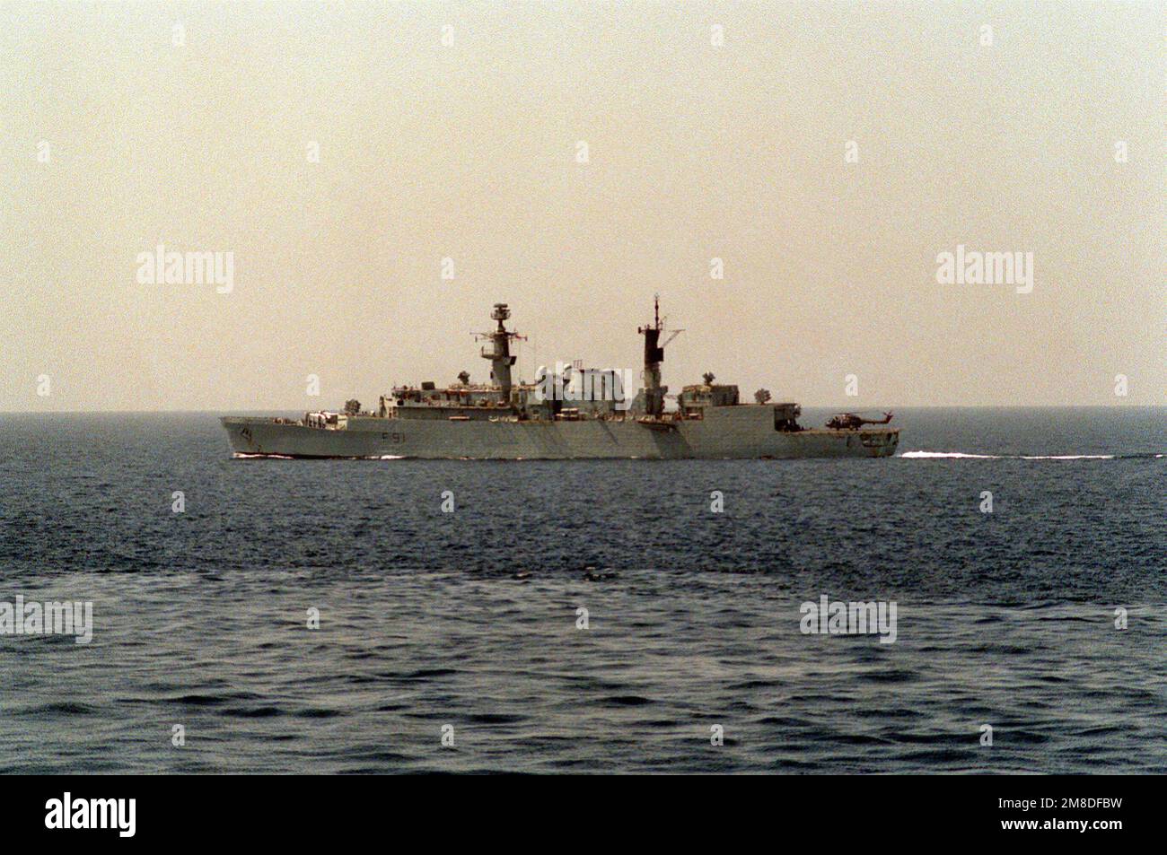 A port beam view of the British frigate HMS BRAZEN ( 91) underway ...