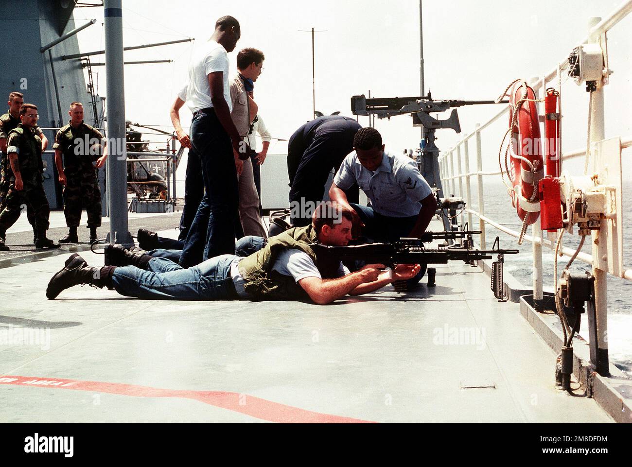 A crew member aboard the amphibious command ship USS BLUE RIDGE (LCC-19 ...
