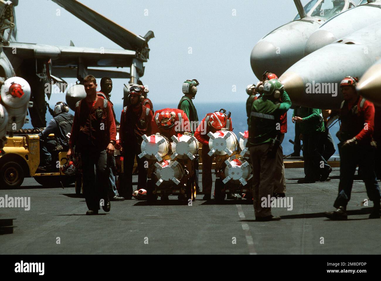 Aviation ordnancemen check the fuses on several Mark 20 Rockeye II ...