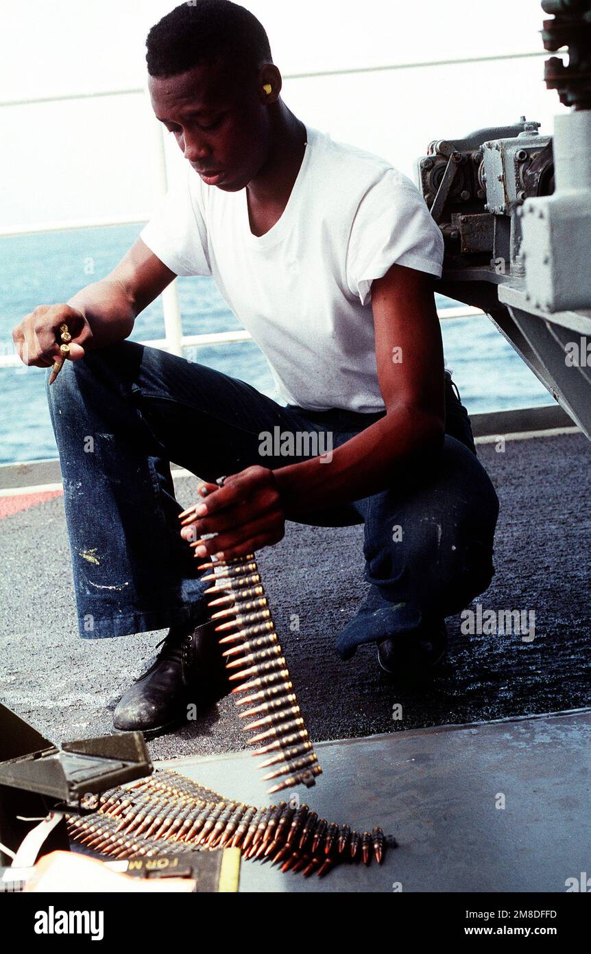 A crew member aboard the amphibious command ship USS BLUE RIDGE (LCC-19 ...