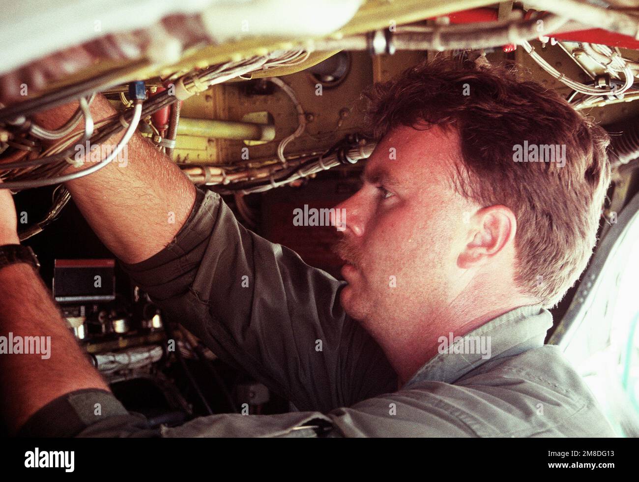 A maintenance crewman from Detachment 2, Helicopter Combat Support ...