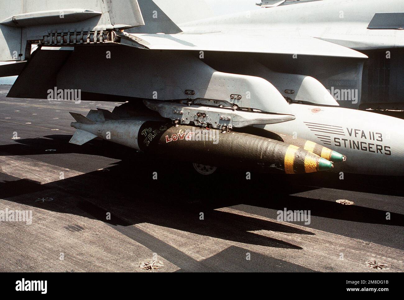 A message adorns one of the Mark 82 500-bombs mounted on the wing of a ...