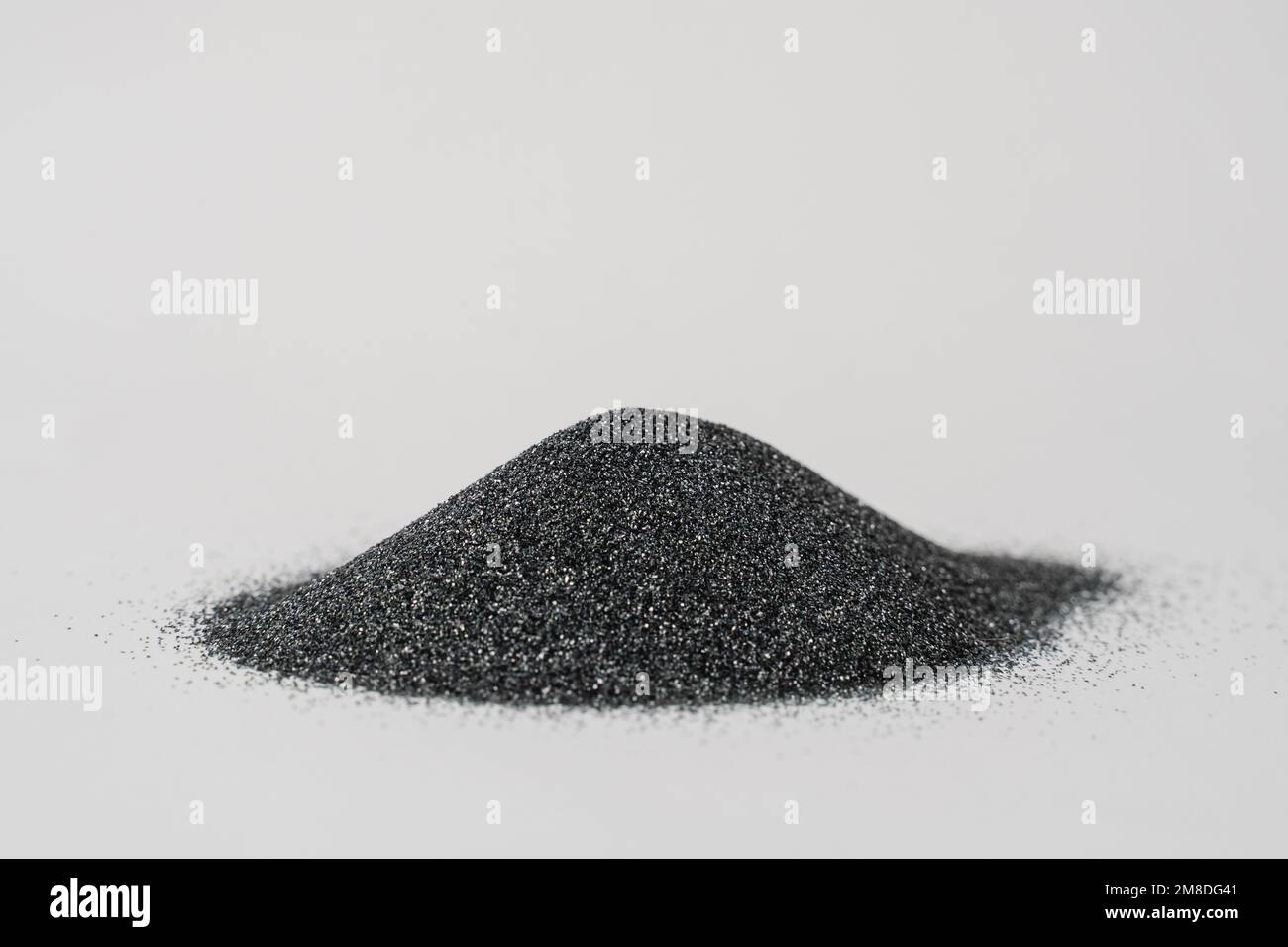 Silicon carbide abrasive powder for leveling stones isolated on white ...