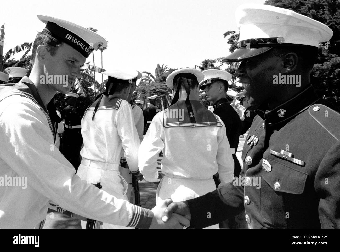 A Soviet Sailor And A U S Marine Shake Hands Following A Wreath Laying