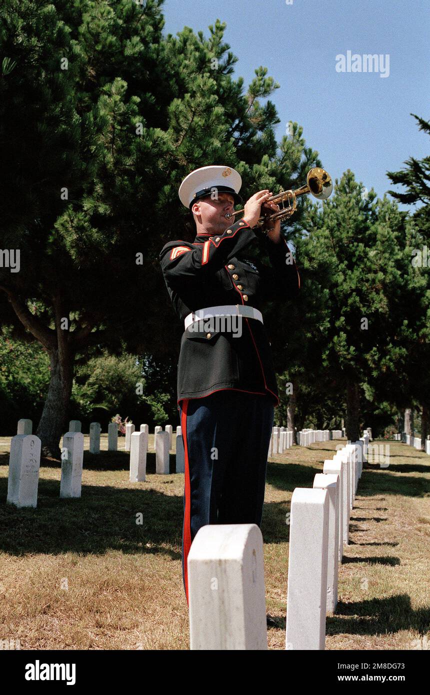 A Marine trumpeter plays during a joint U.S./Soviet wreath-laying ...