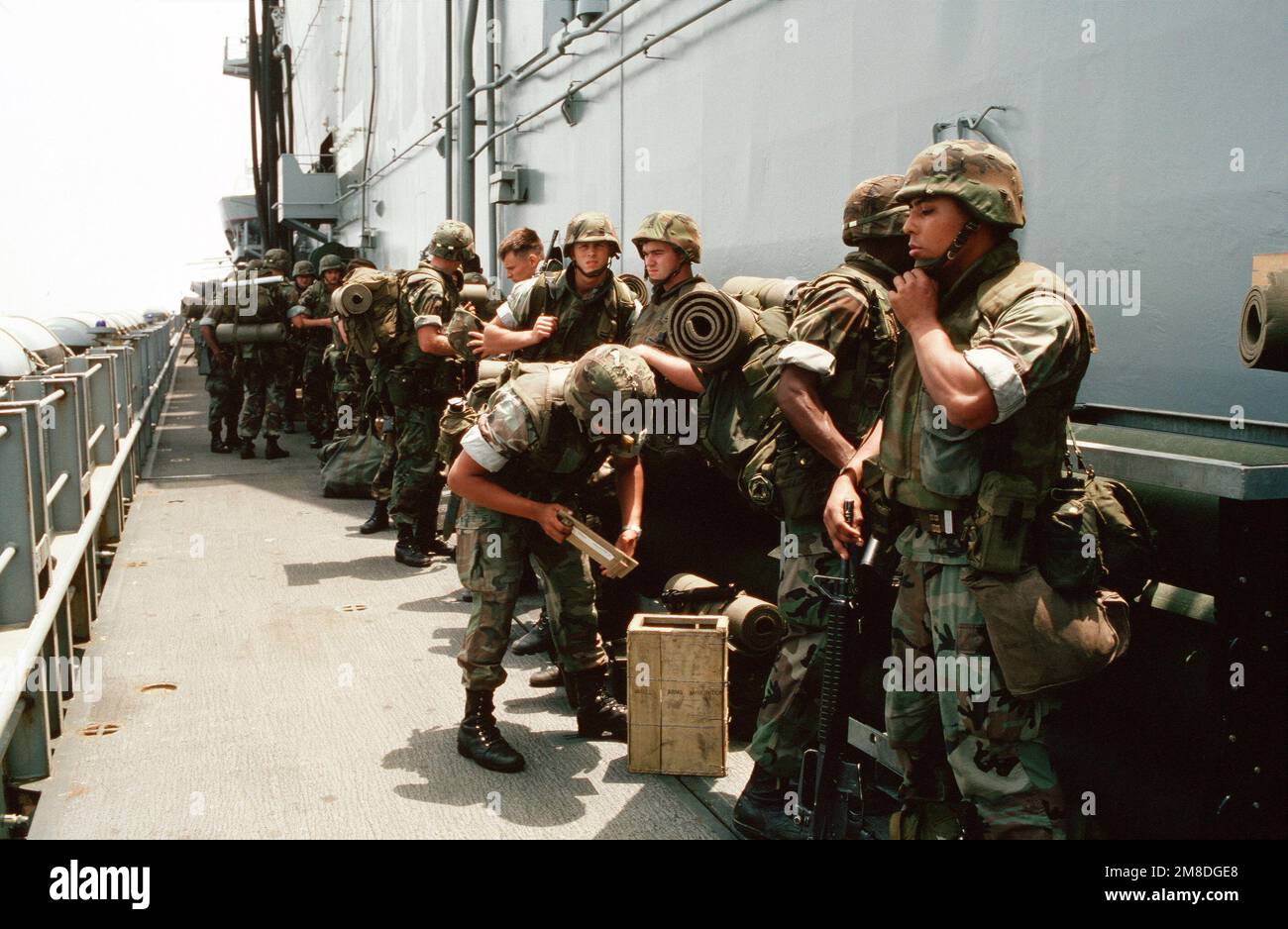 Marines of the 22nd Marine Expeditionary Unit (22nd MEU) stand by to ...
