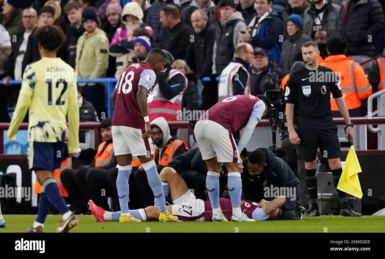 Birmingham, UK. 13th January 2023. Lucas Digne of Aston Villa lies injured on the floor with a ...