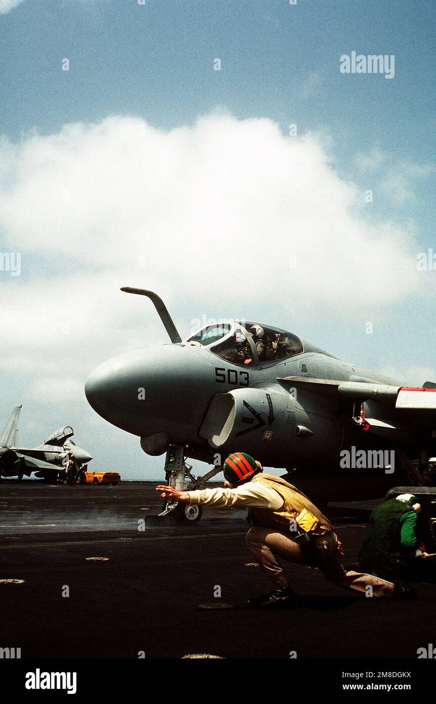A catapult officer gives the signal to launch an Attack Squadron 196 ...