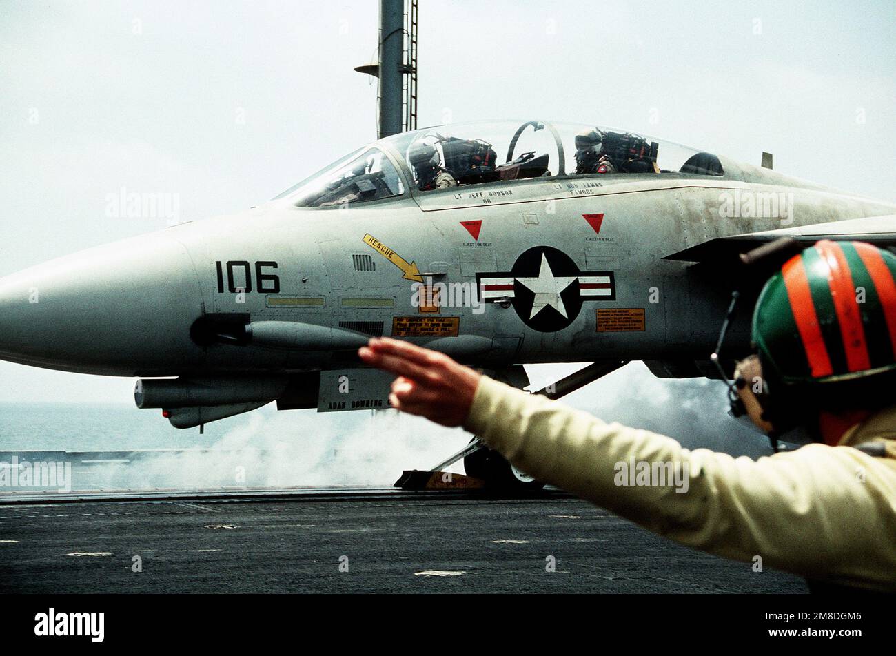 A catapult officer gives the signal to launch an Attack Squadron 196 ...