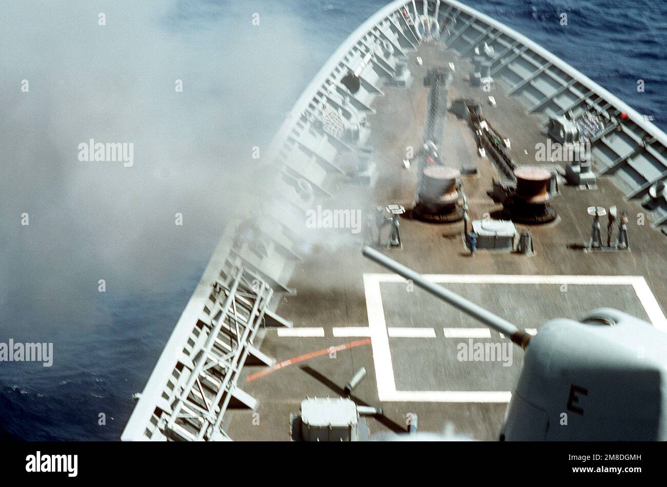 The forward Mark 45 5-inch/54-caliber gun aboard the guided missile ...