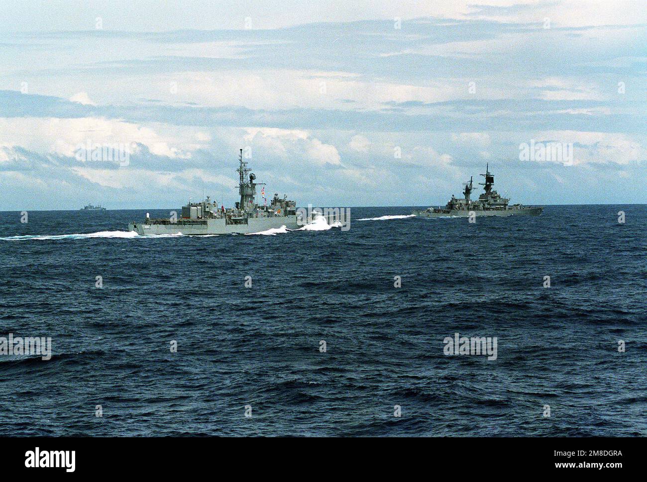 The ammunition ship USS FLINT (AE-32), left background, the frigate USS ...