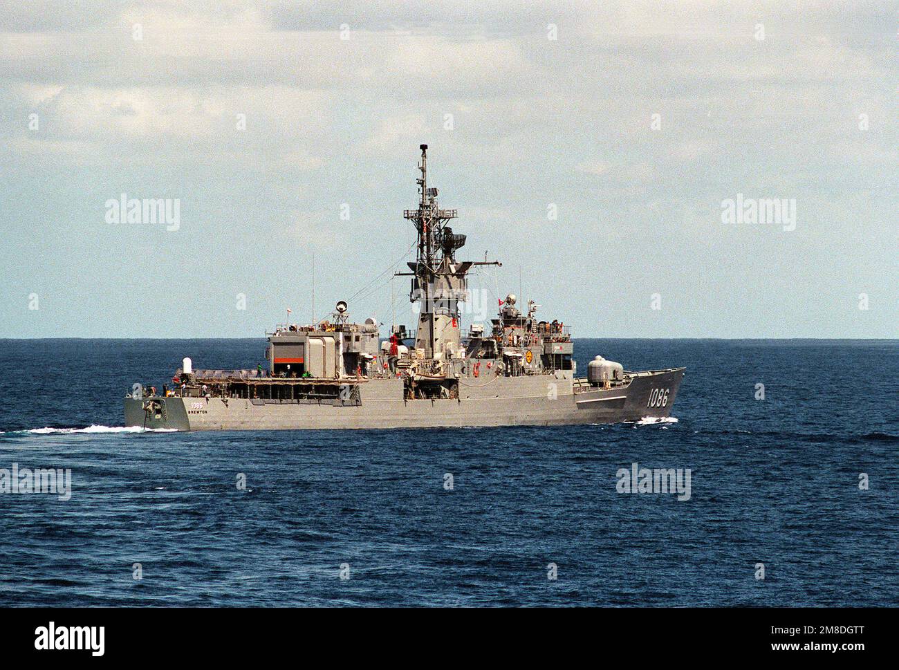 A starboard quarter view of the frigate USS BREWTON (FF-1086) underway ...